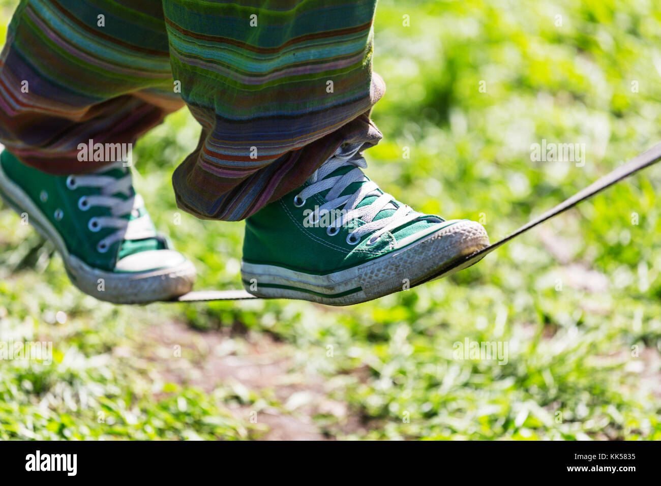 Slacklining is a practice in balance Stock Photo - Alamy