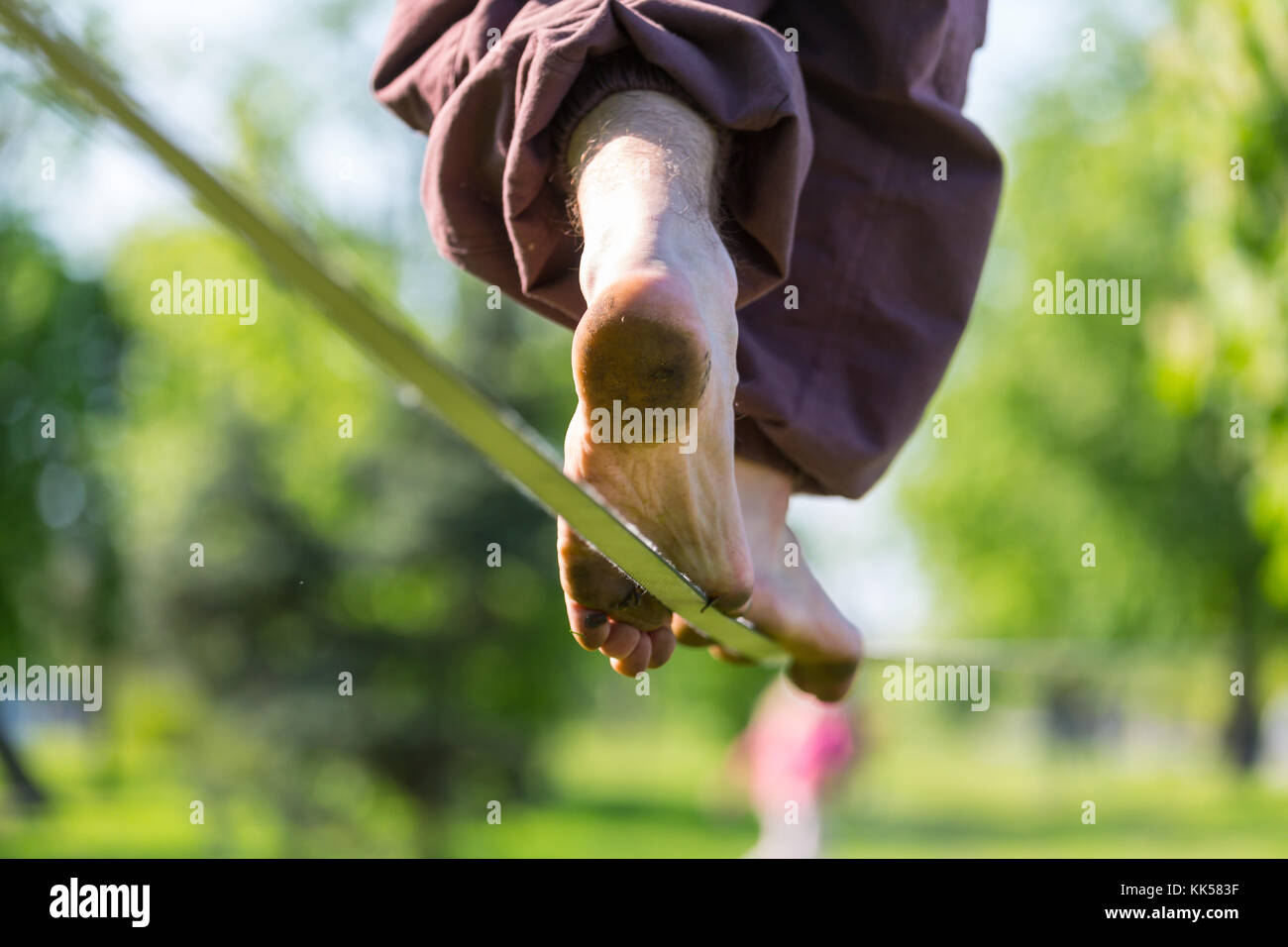 Slacklining is a practice in balance Stock Photo - Alamy