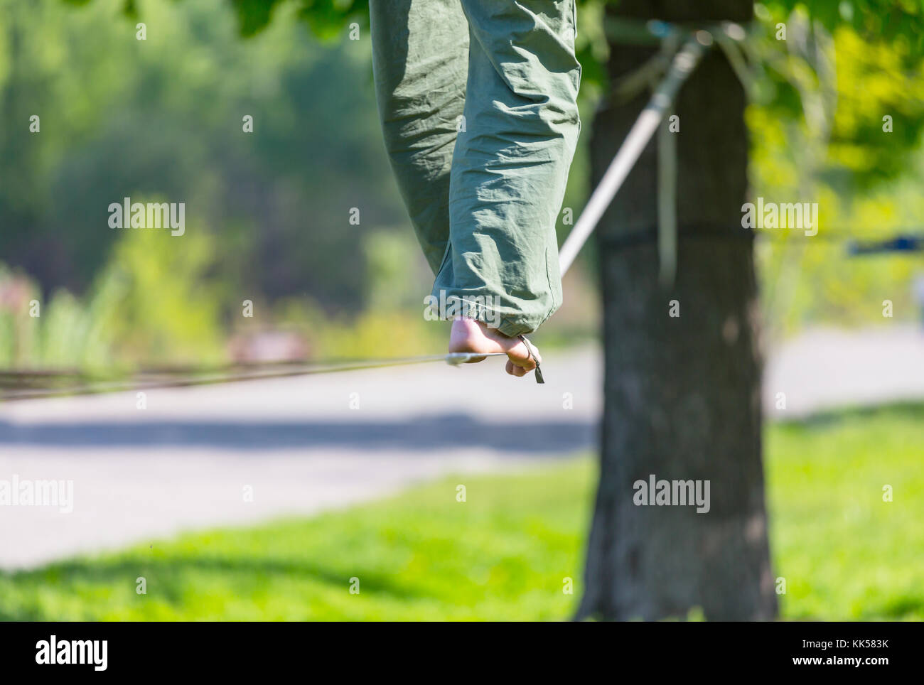 Slacklining is a practice in balance Stock Photo - Alamy