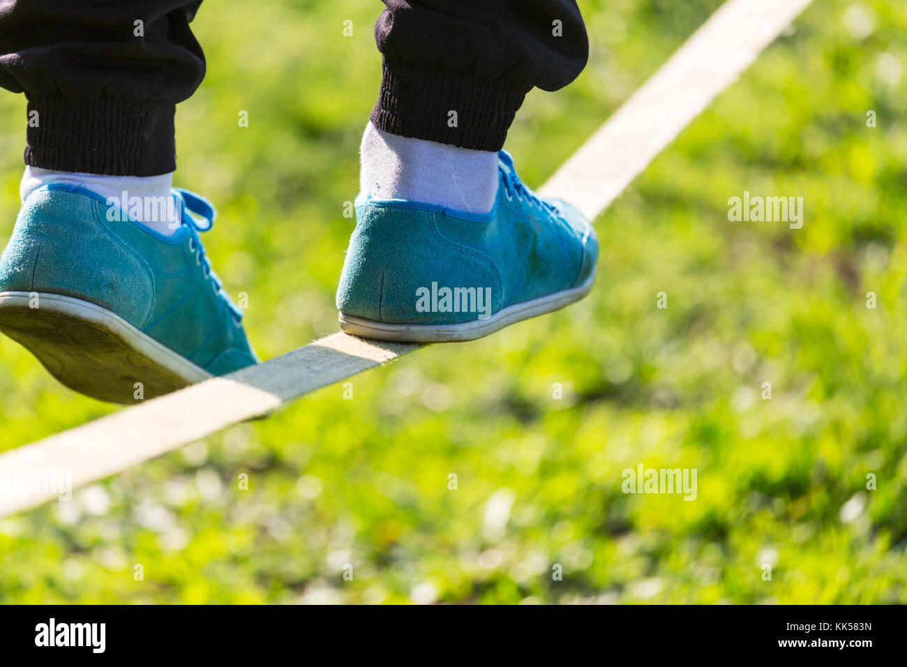 Slacklining is a practice in balance Stock Photo - Alamy