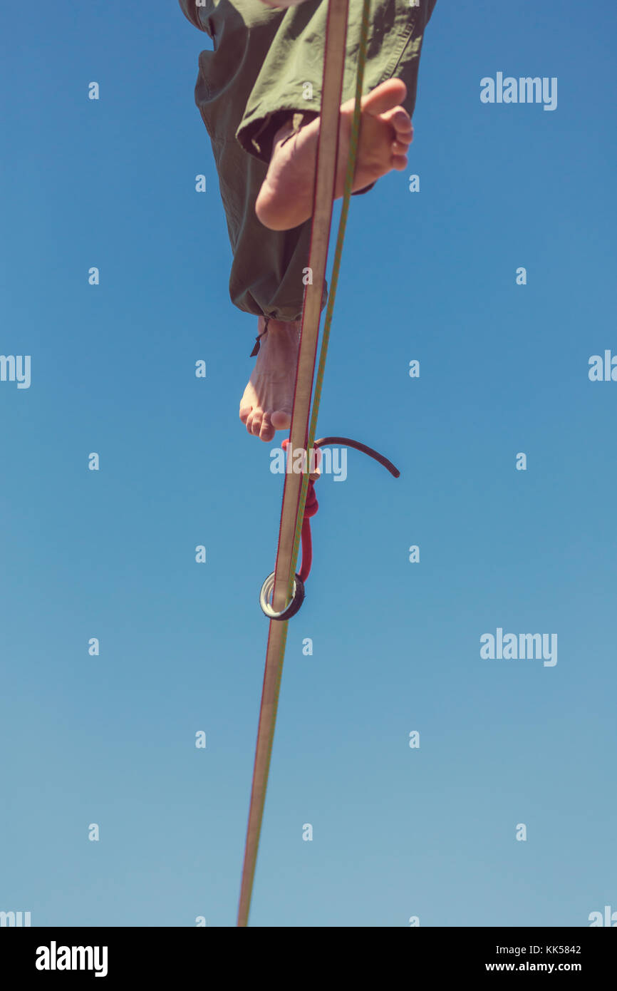 Slacklining is a practice in balance Stock Photo - Alamy