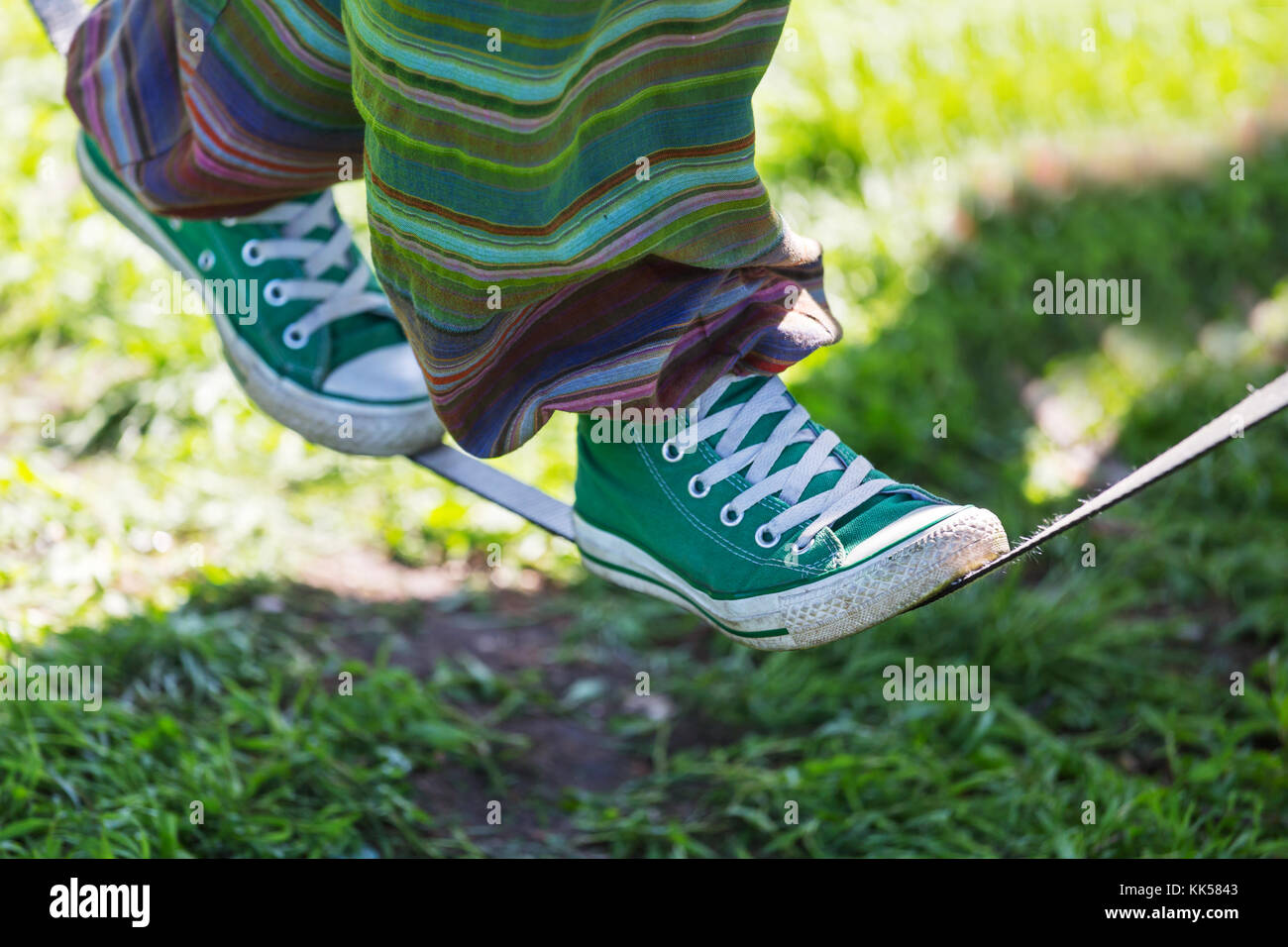 Slacklining is a practice in balance Stock Photo - Alamy