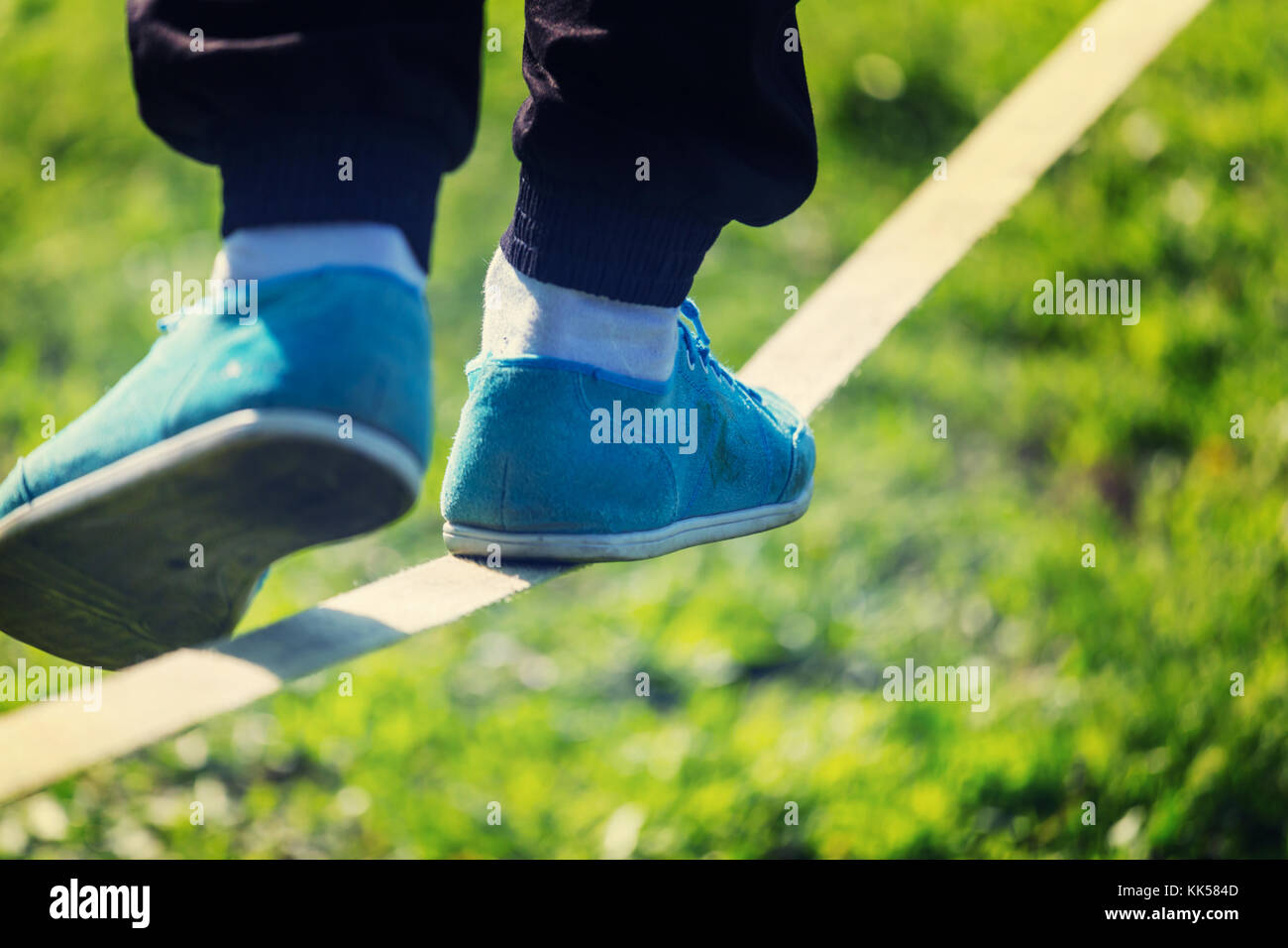 Slacklining is a practice in balance Stock Photo - Alamy
