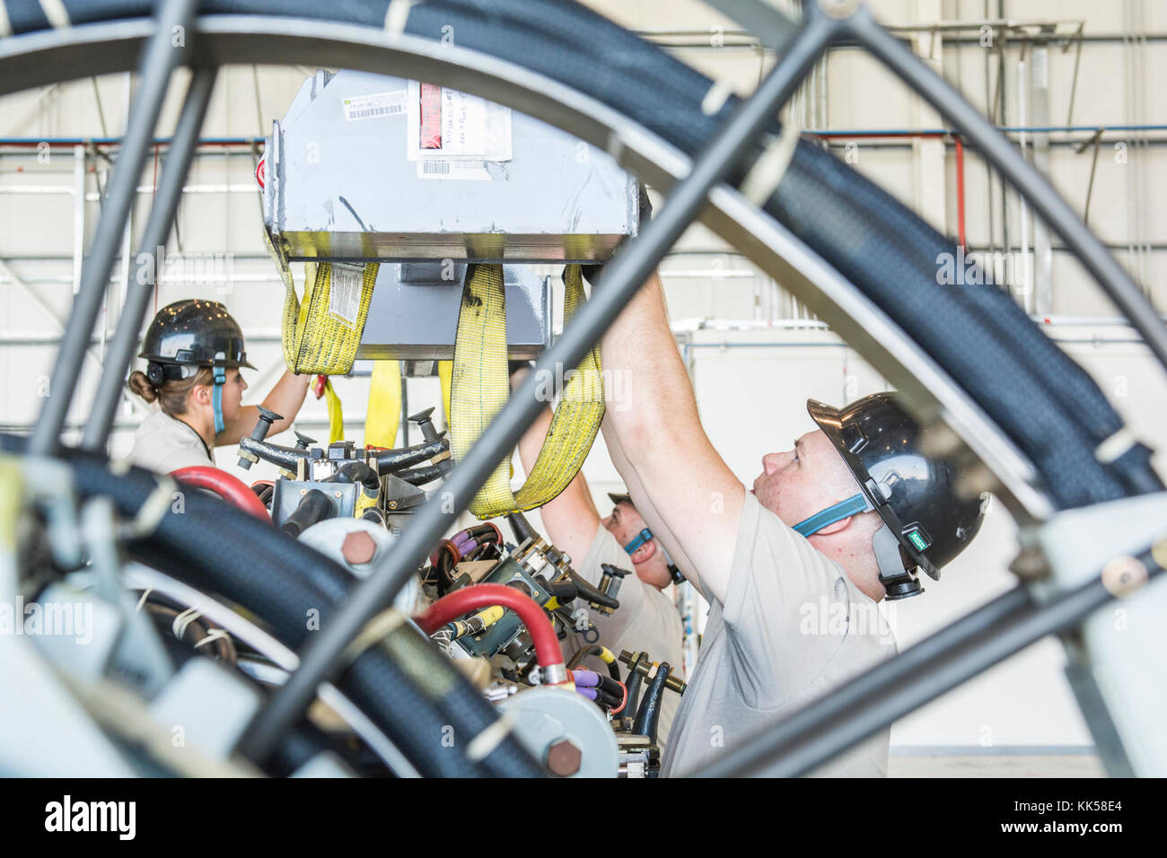 U.S. Airmen with the 379th Expeditionary Maintenance Squadron prepare a ...