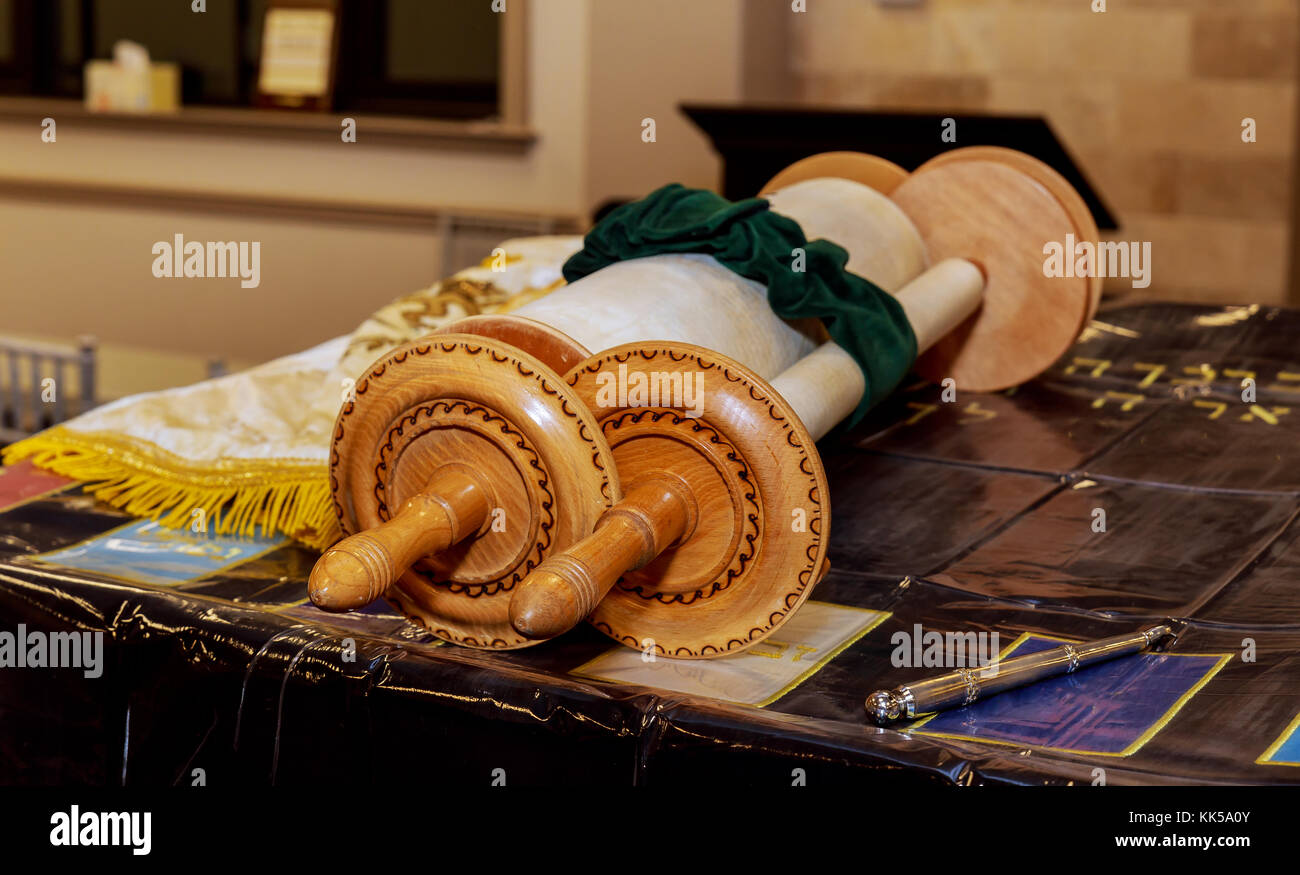 Classical Torah scrolls in a blue case with Hebrew letters. Torah is ...