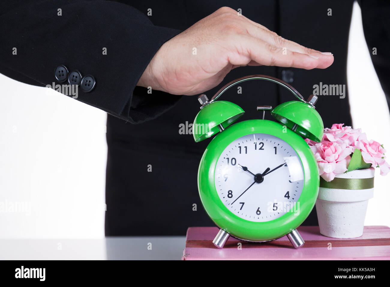 Businessman saving time Stock Photo - Alamy