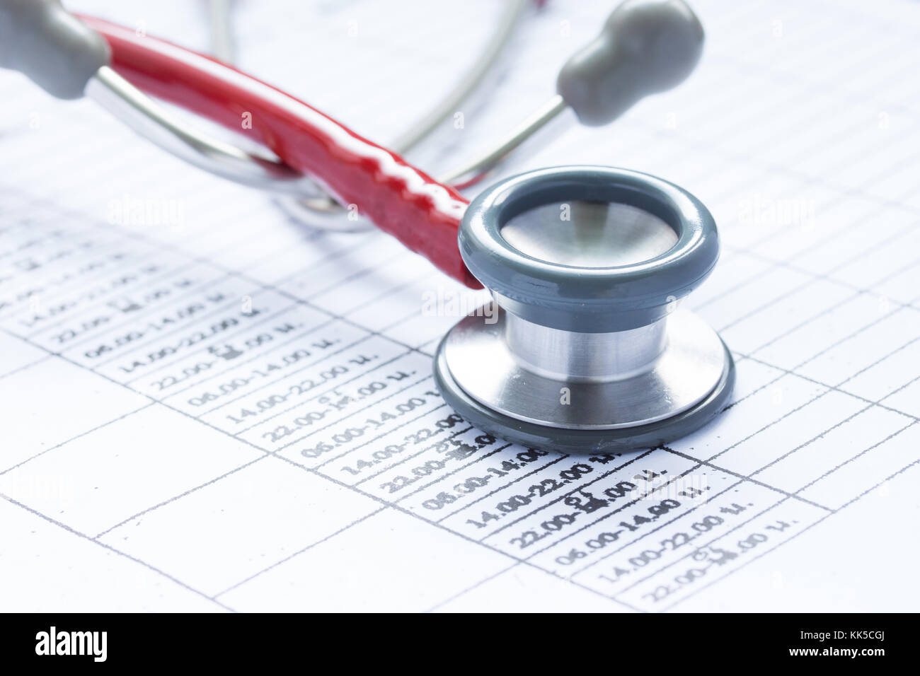 Stethoscope and time sheet Stock Photo - Alamy