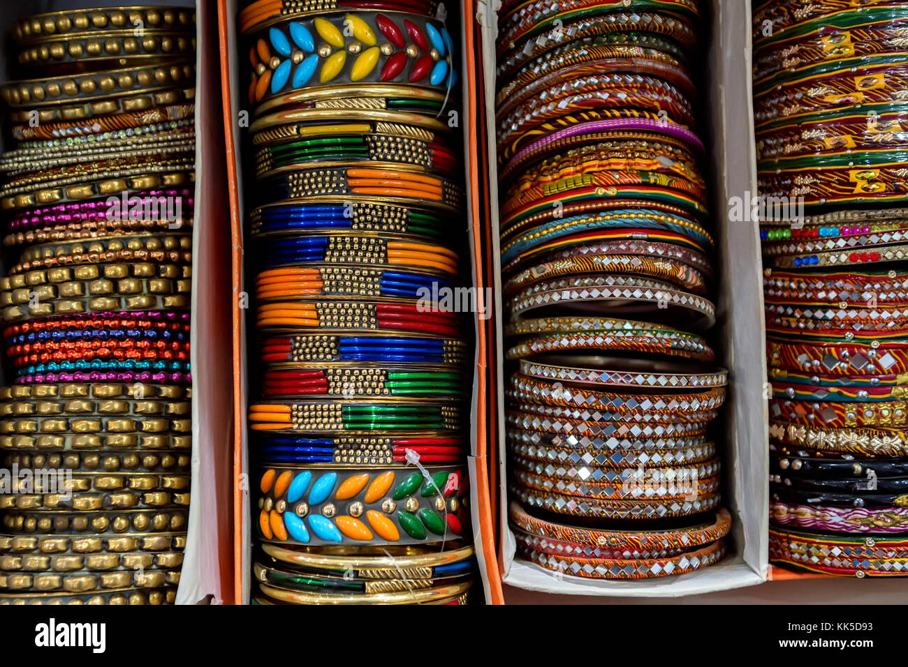 Many colorful Indian bracelets in box on market Stock Photo - Alamy