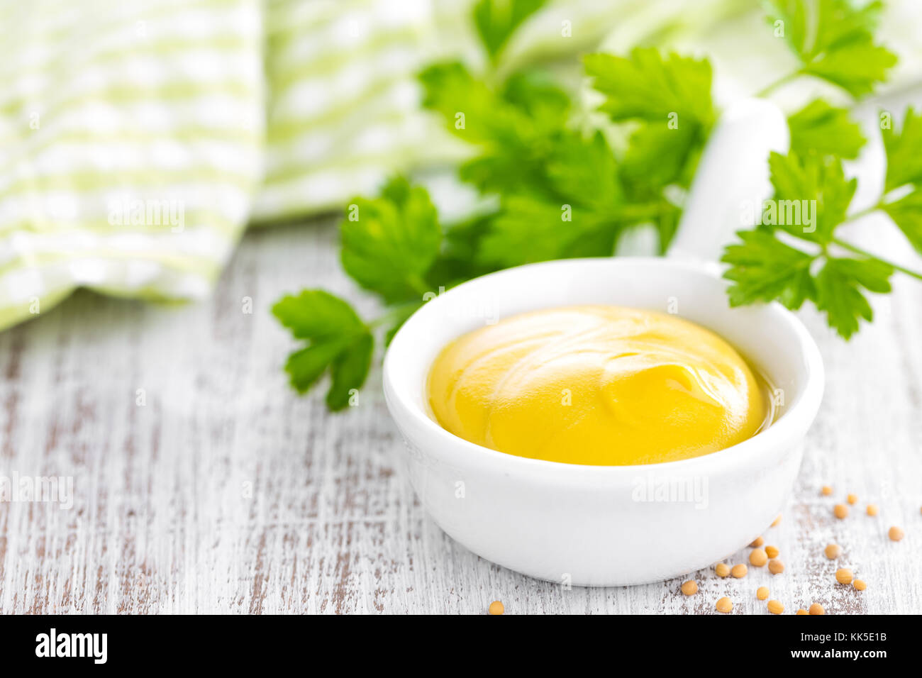 Mustard on white background Stock Photo - Alamy