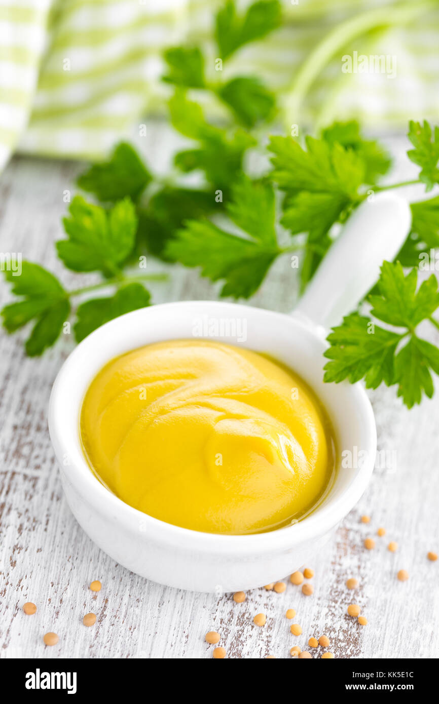 Mustard on white background Stock Photo - Alamy