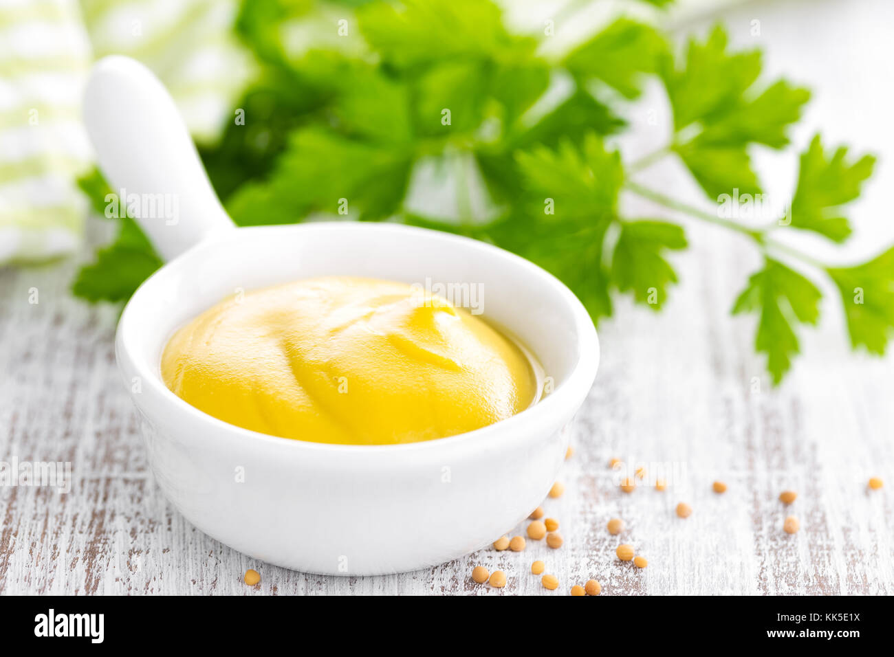 Mustard on white background Stock Photo - Alamy
