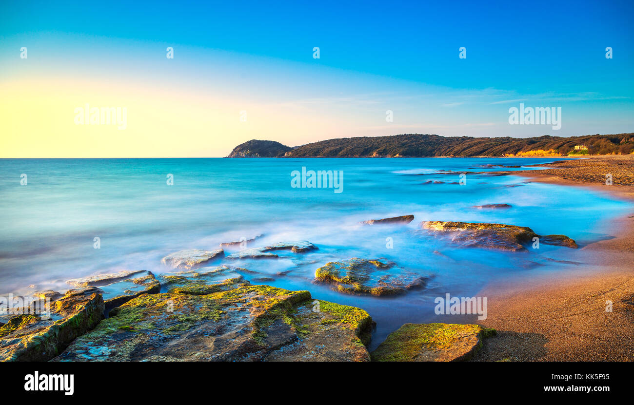 Baratti beach bay, travel destination, headland hill, rocks and sea on ...