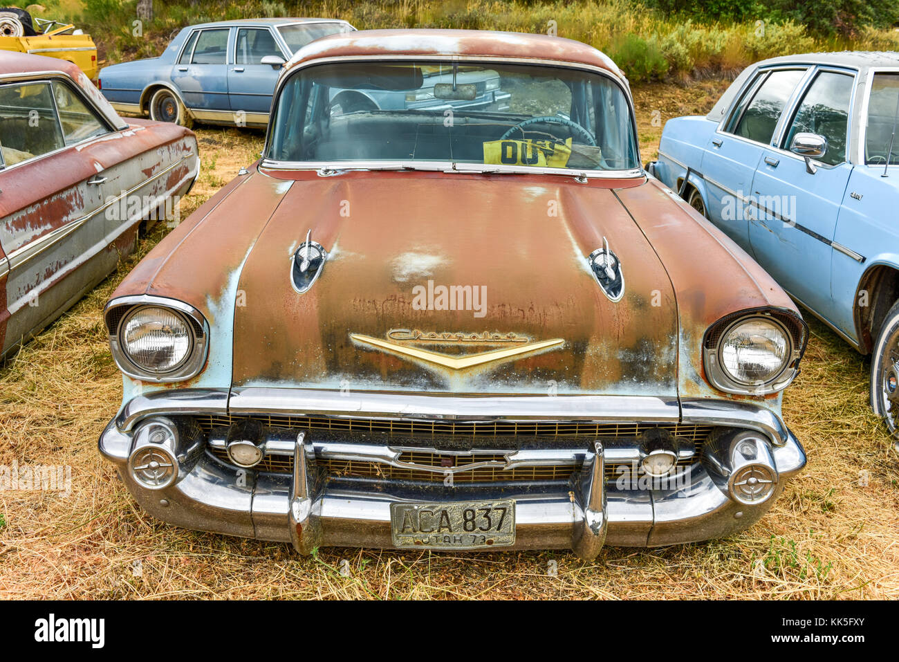 Rusting old car in a desert junk yard Stock Photo - Alamy