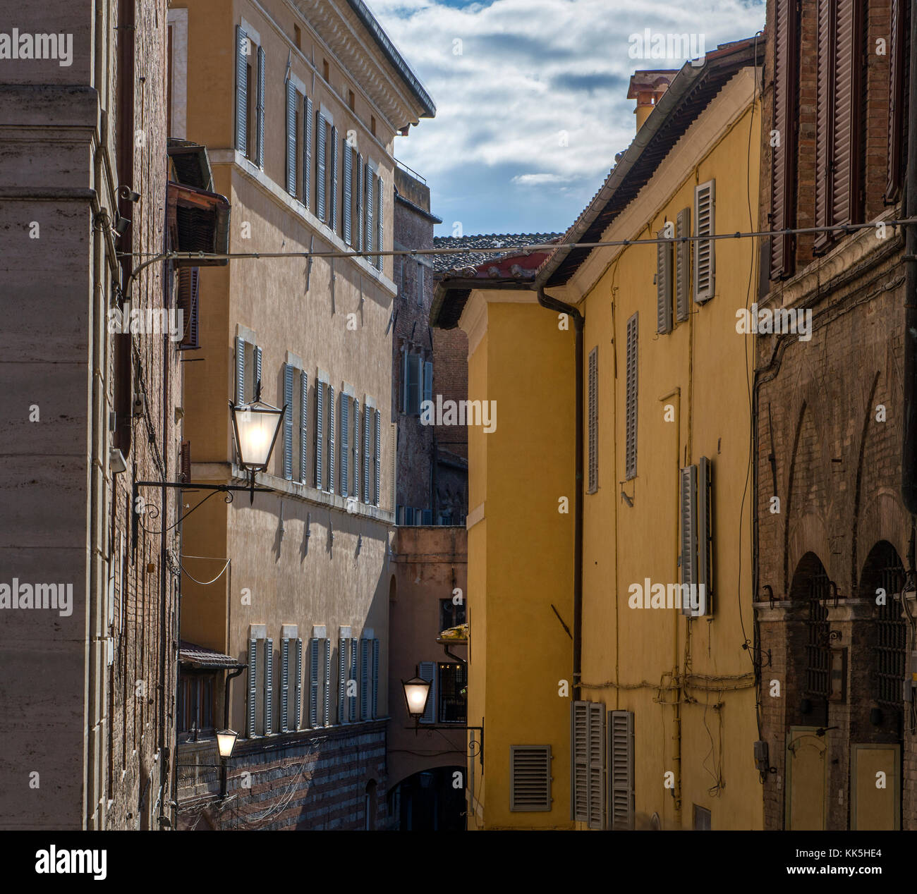 lighted up Street lights in Siena, Italy on dusk Stock Photo - Alamy