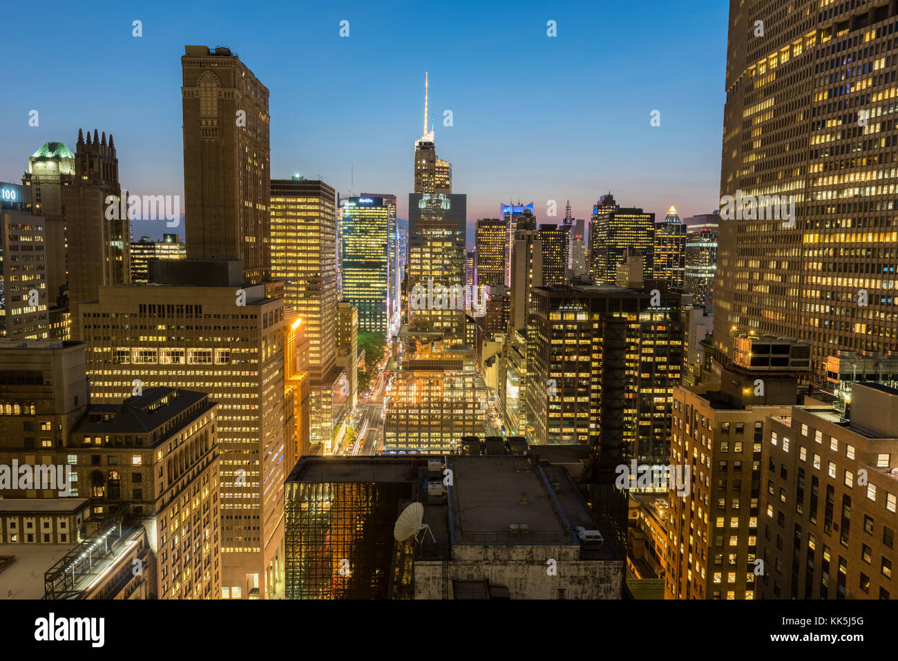 Towering skyscrapers in midtown Manhattan in New York City at sunset ...