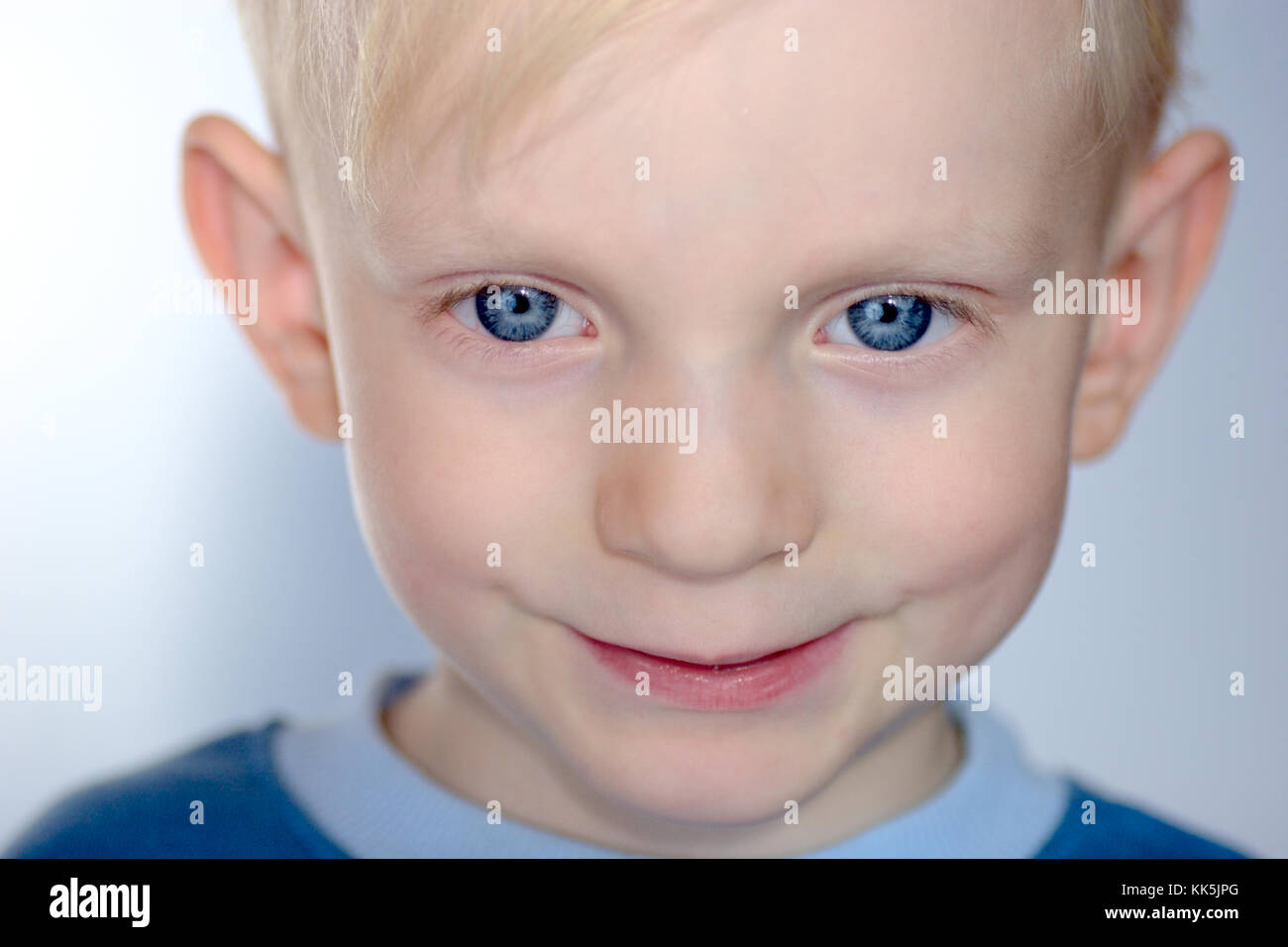 Closeup portrait of Upset child with his eyes almost closed Stock Photo ...