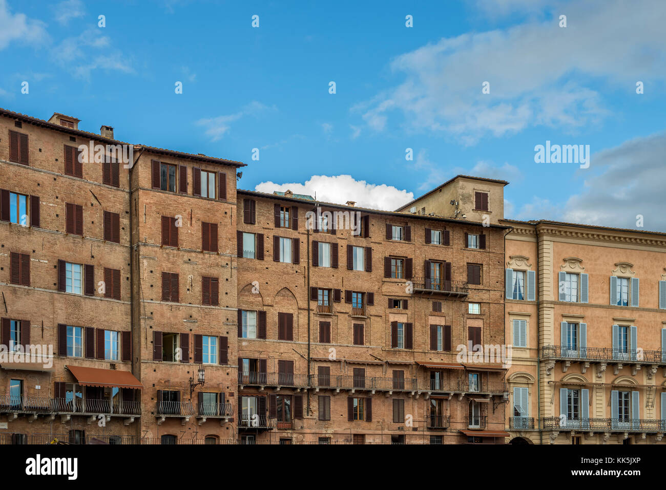 Beautiful view of a italian street in siena, toscana, windows and ...