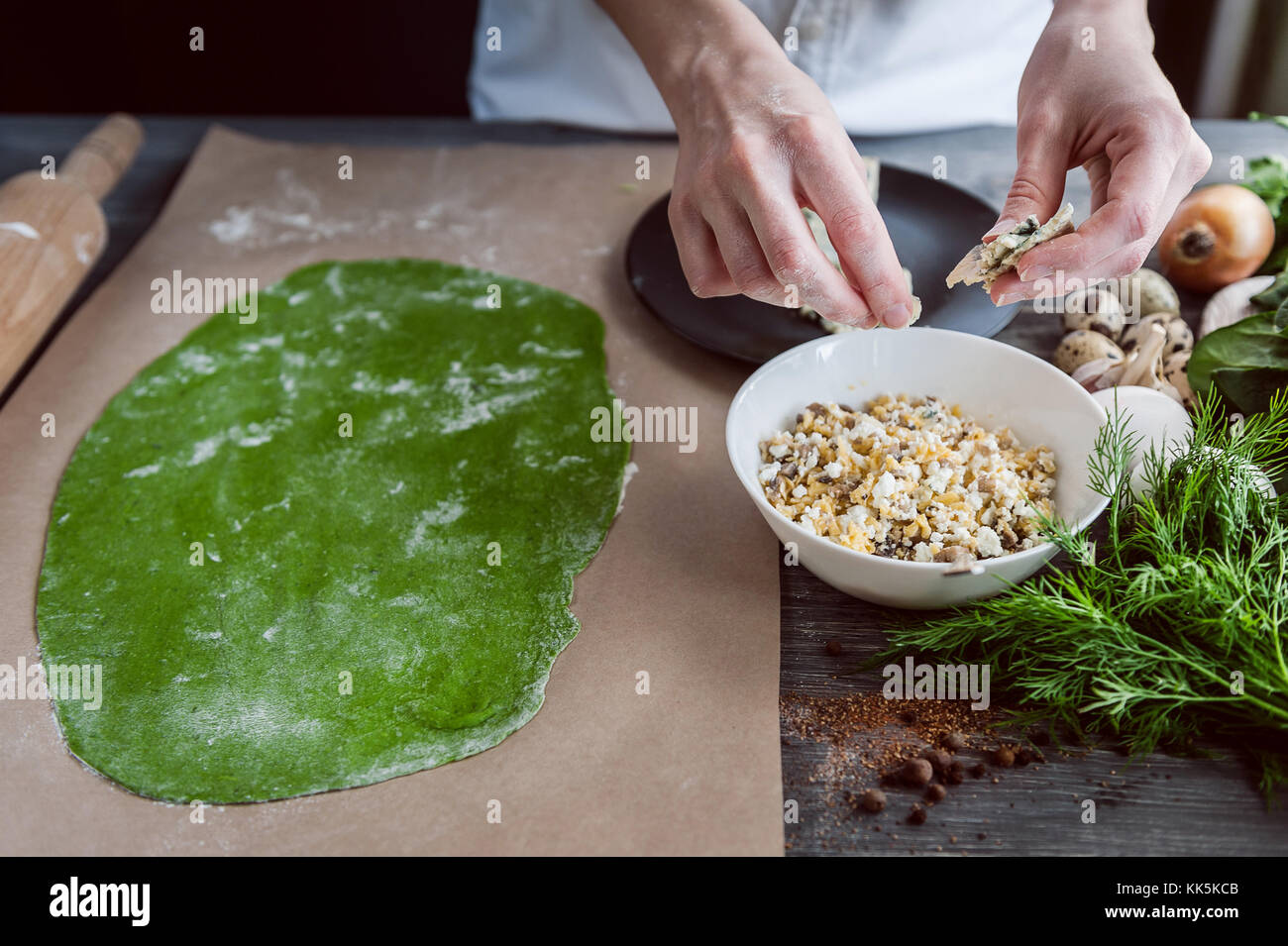 chef step by step, preparing a green ravioli with the addition of ...