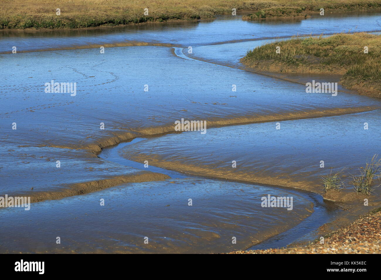 Low tide meandering pattern of water in mud, tributary of River Ore ...