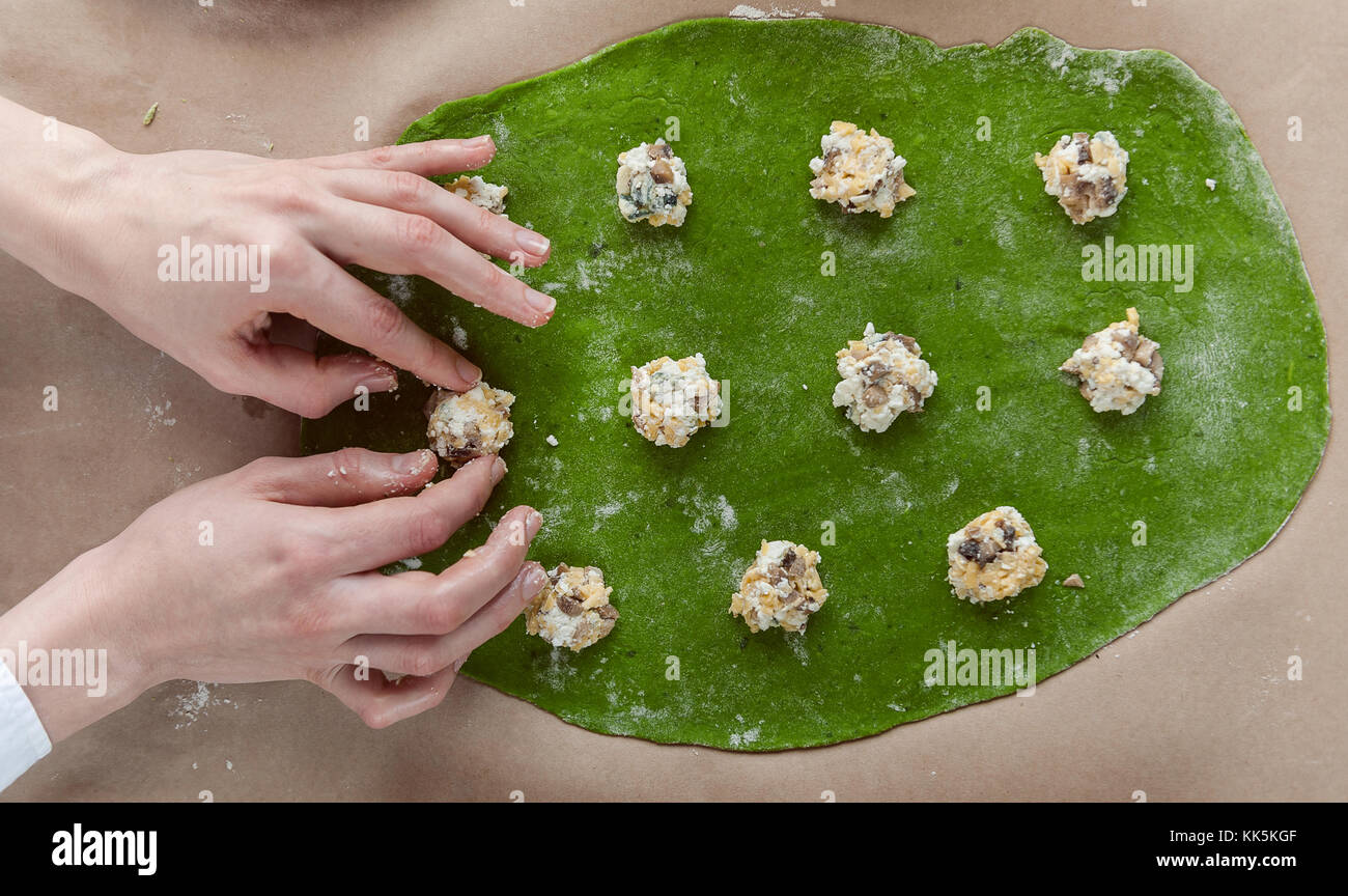 chef step by step, preparing a green ravioli with the addition of ...