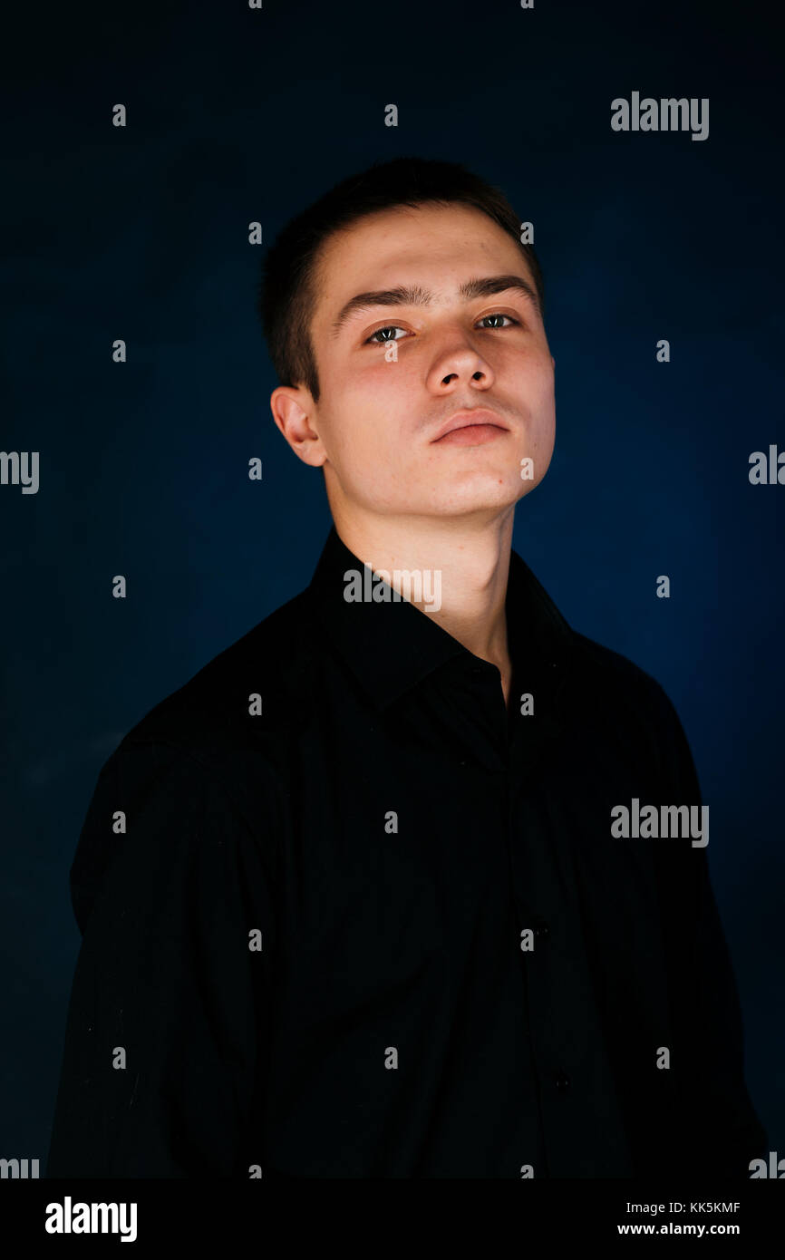 young guy on a dark studio background Stock Photo - Alamy