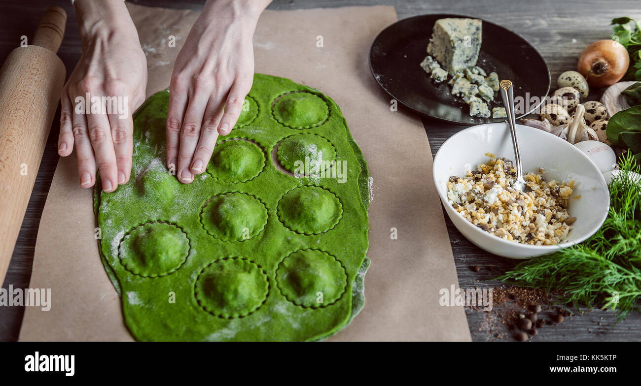 chef step by step, preparing a green ravioli with the addition of ...