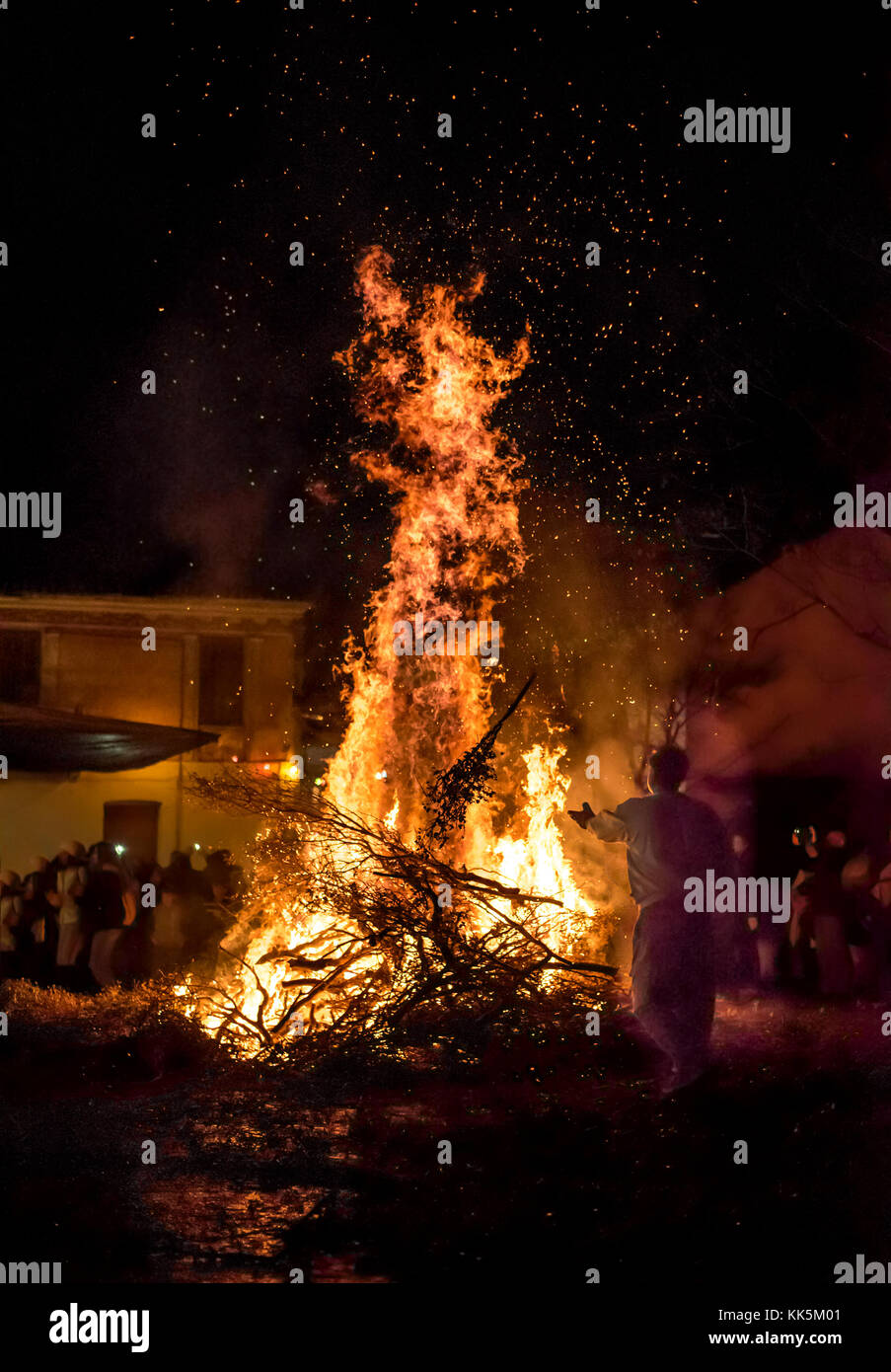 People celebrate St John's Eve around a bonfire in a greek village ...
