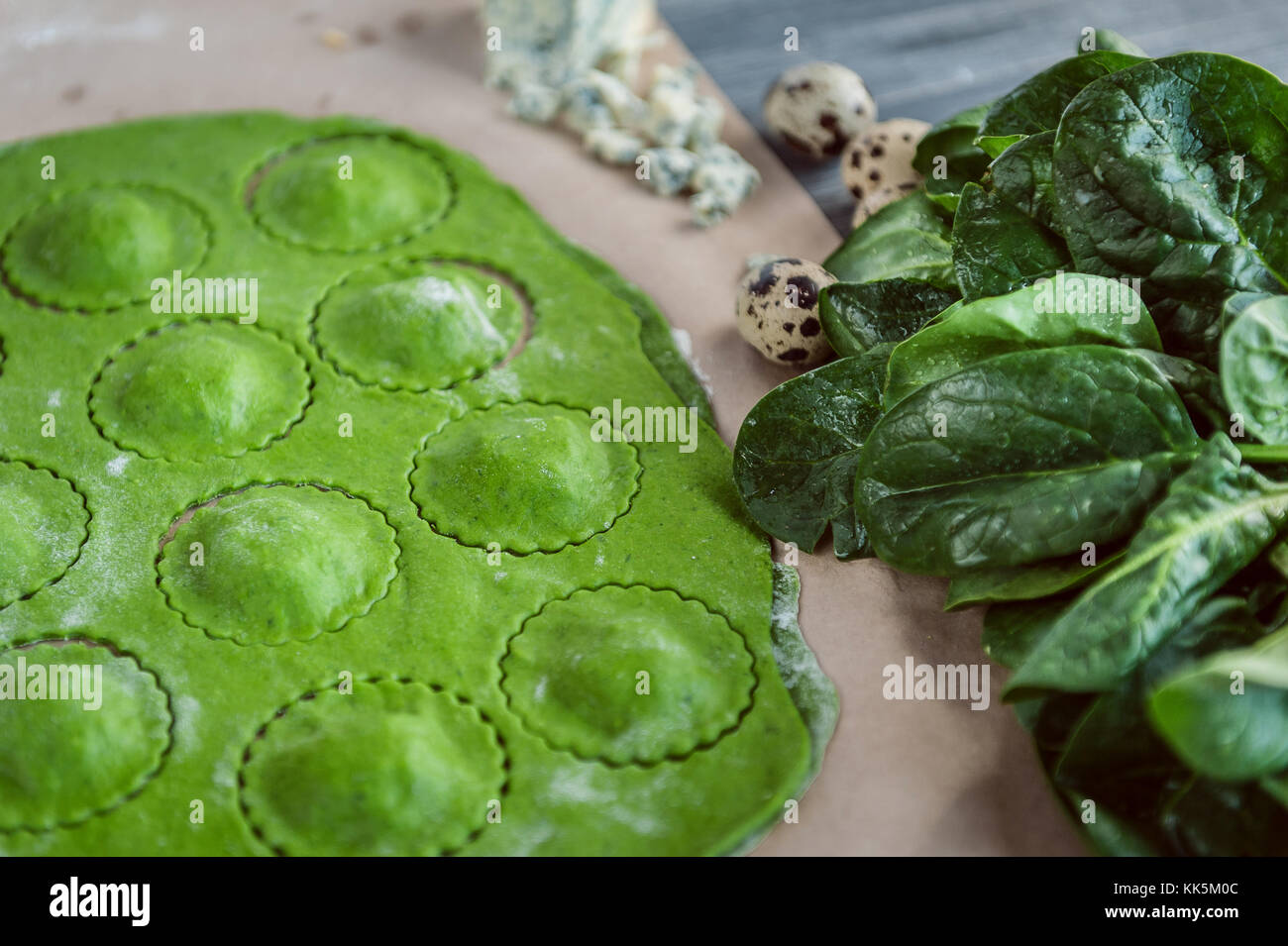 chef step by step, preparing a green ravioli with the addition of ...