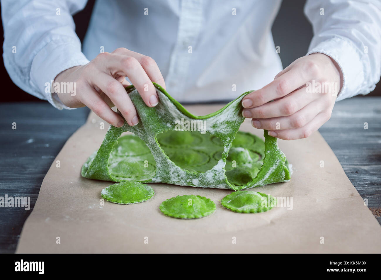 chef step by step, preparing a green ravioli with the addition of ...