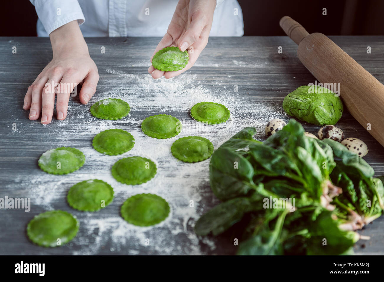 chef step by step, preparing a green ravioli with the addition of ...