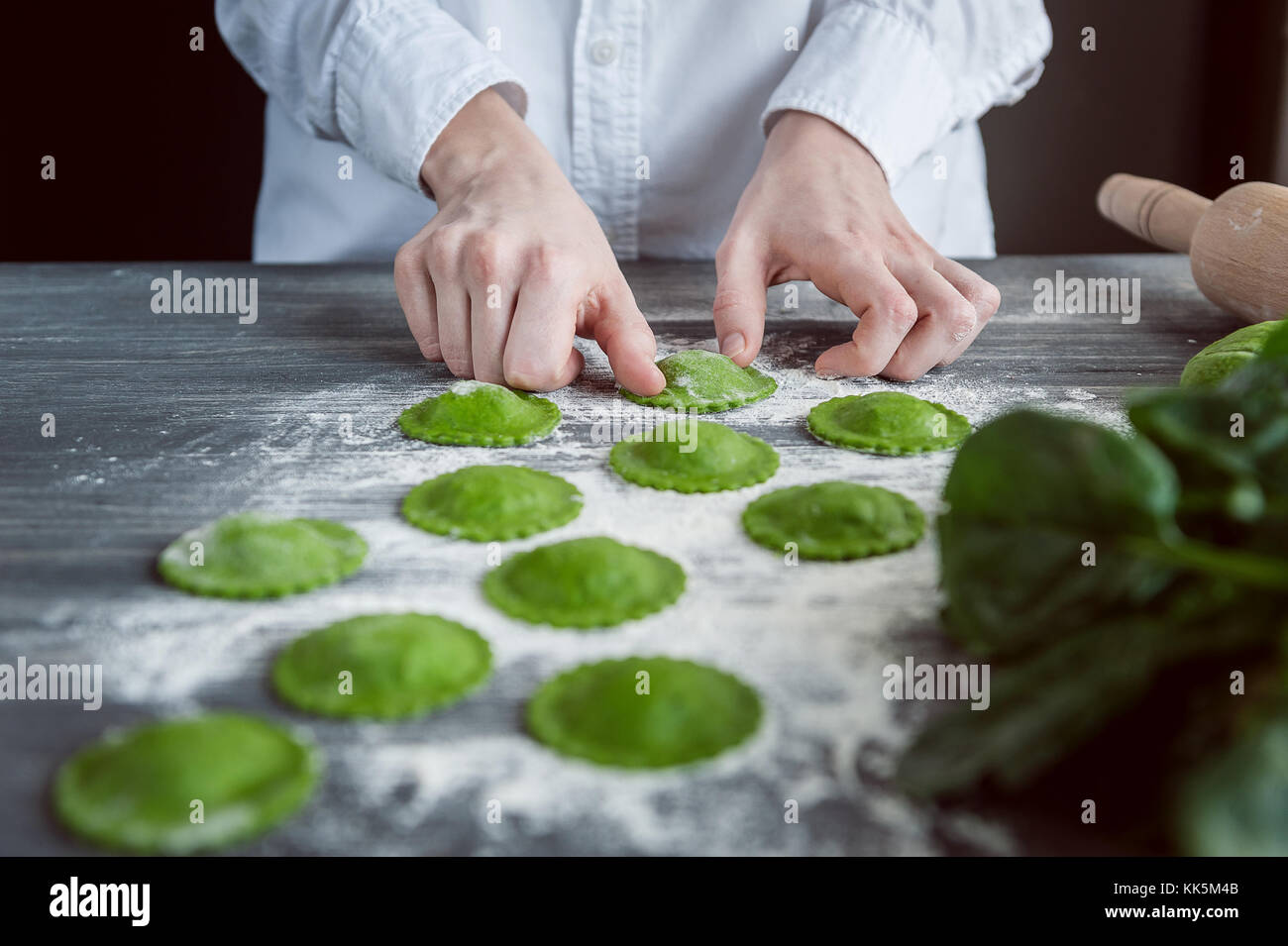 chef step by step, preparing a green ravioli with the addition of ...