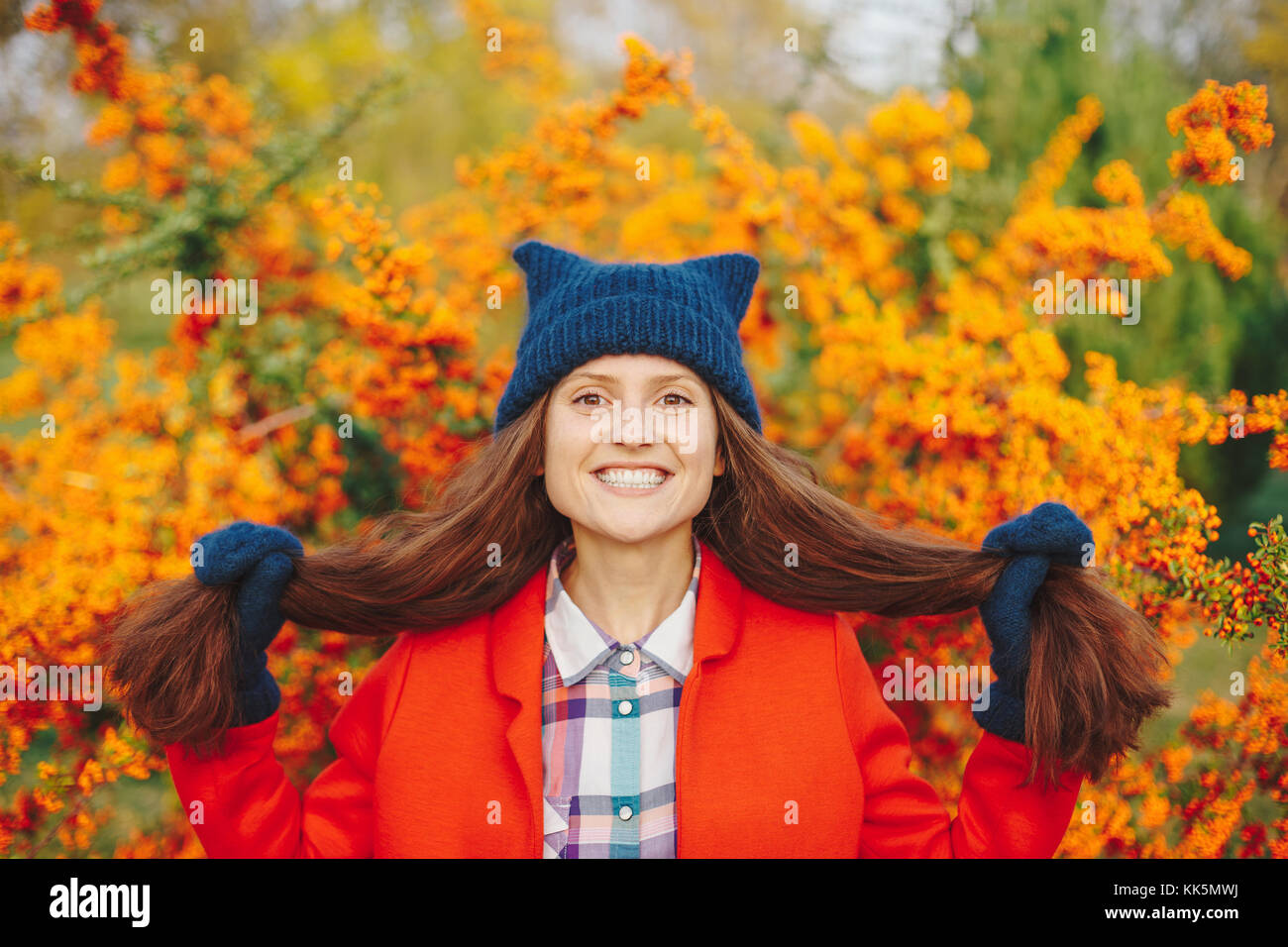 Model wearing stylish winter beanie hat and gloves smiling Stock Photo ...