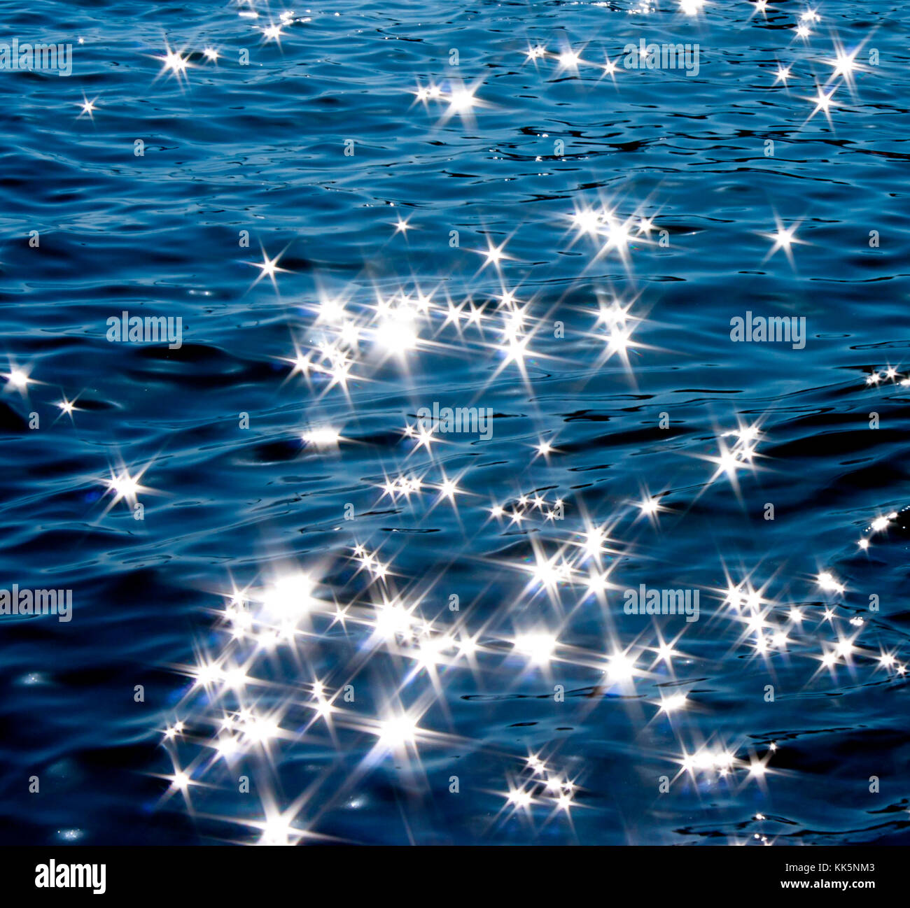 Detail of a moonlight reflecting in glittering sea Stock Photo - Alamy