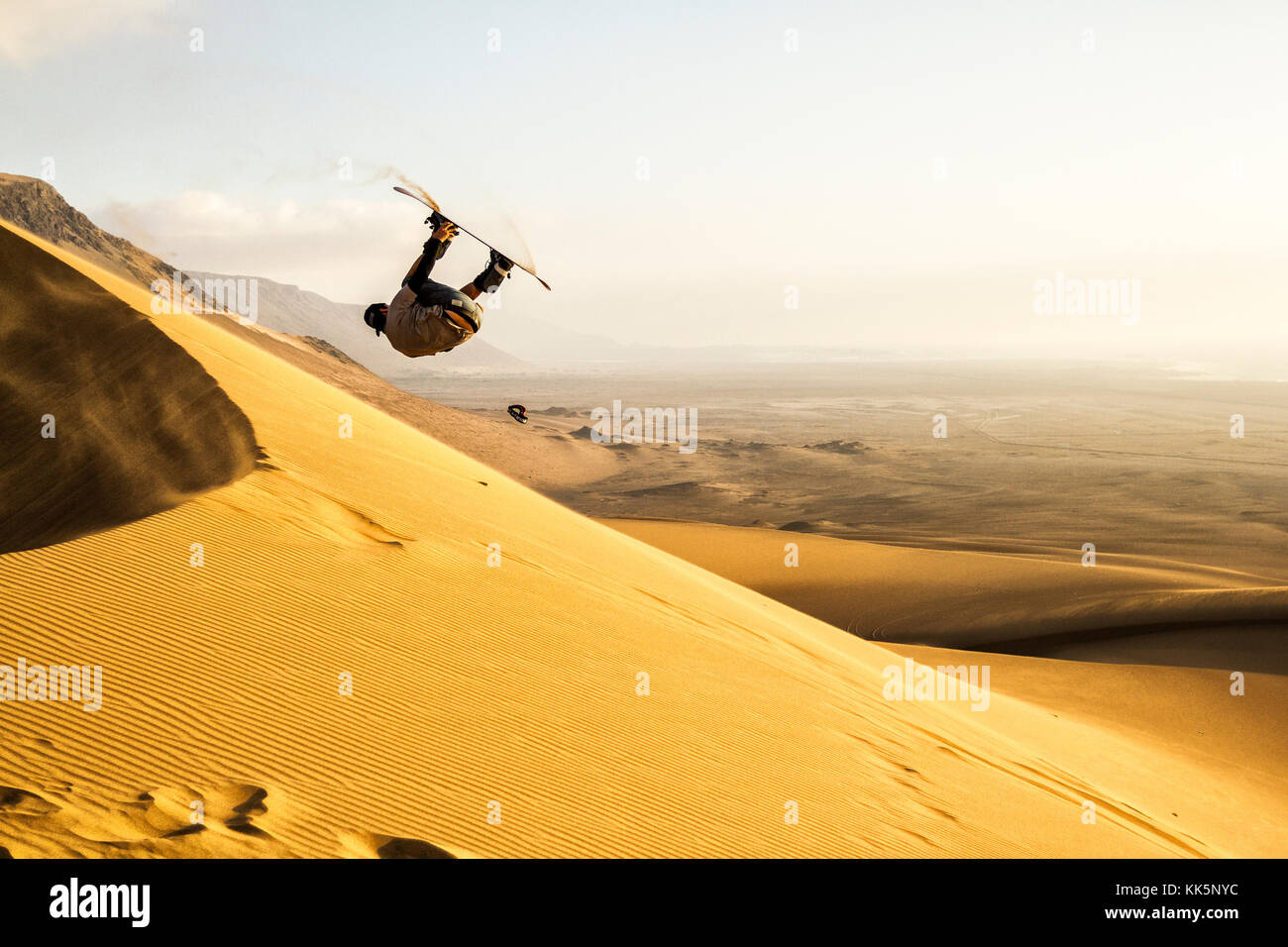 Sandboarding on Caramucho dunes, in Atacama Desert. Iquique, Tarapaca ...