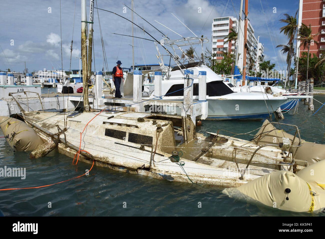 U.S. Coast Guard Chief Warrant Officer Christopher Runt observes a ...