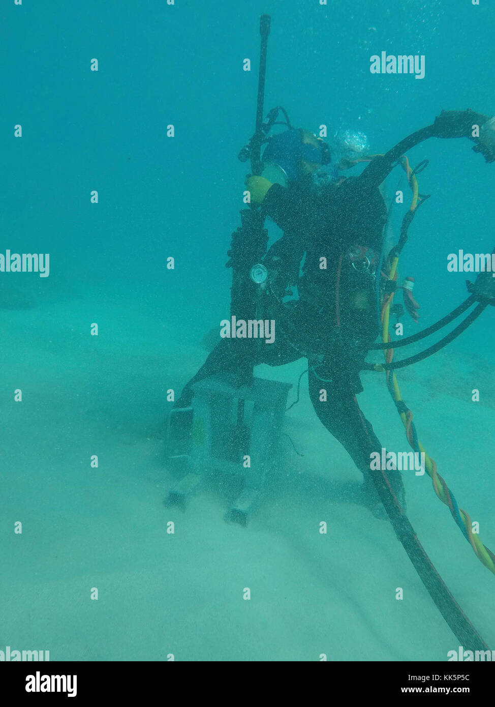 American Marine divers installed mooring anchors in sand off of Kaimana ...