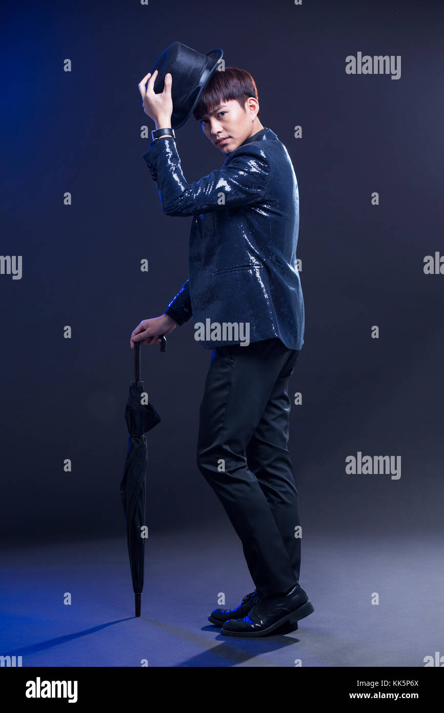 Young Chinese male magician Stock Photo - Alamy