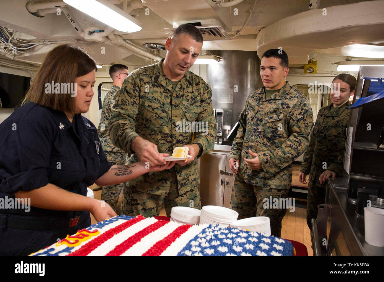 U.S. Navy culinary specialist 2nd class Justinne Ivanitsky, left, and ...