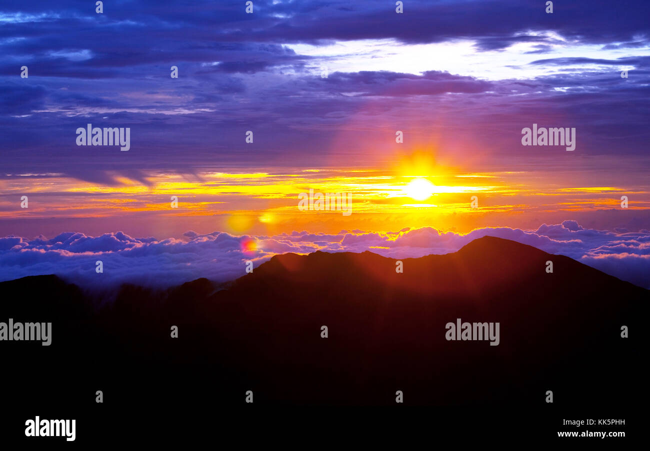Sunset in mountains Stock Photo - Alamy