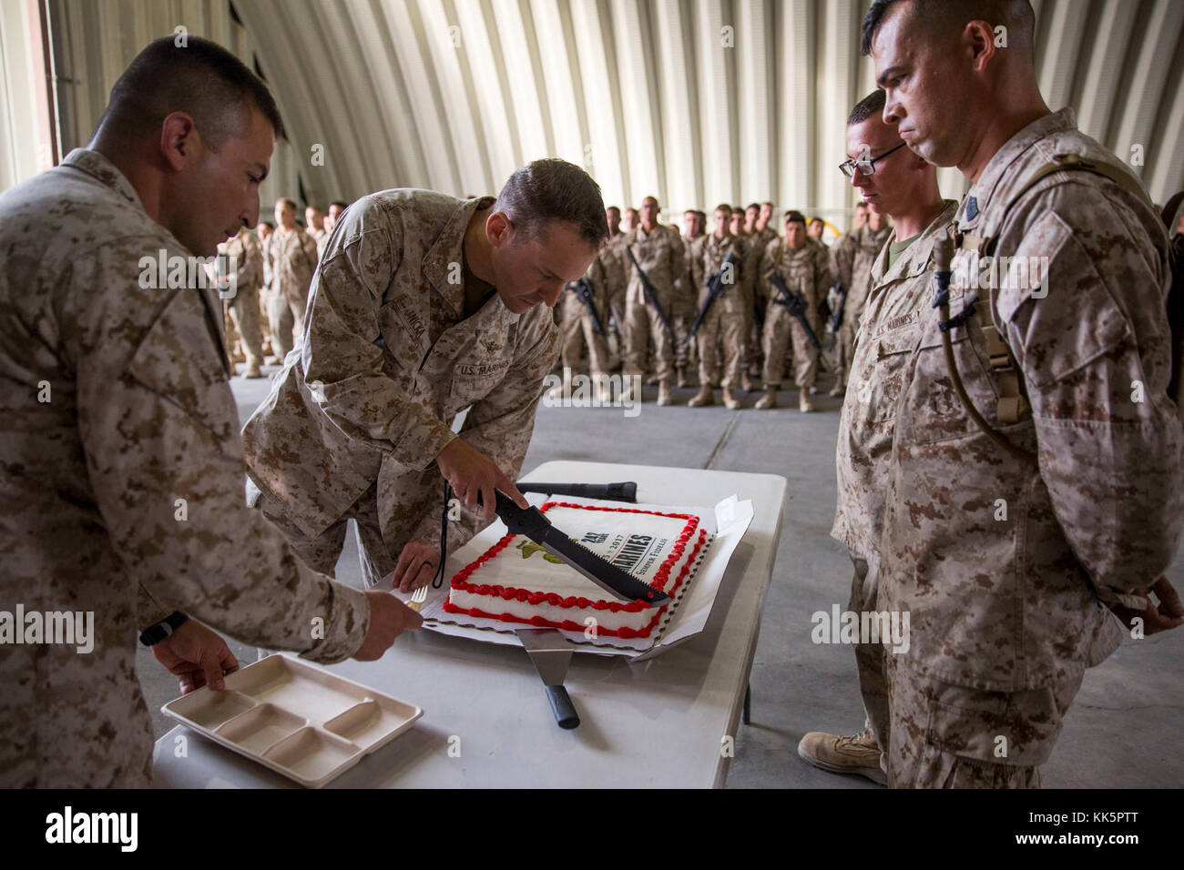 U.S. Marine Corps Lt. Col. Roy Nicka with Marine Aircraft Group 31 cuts ...