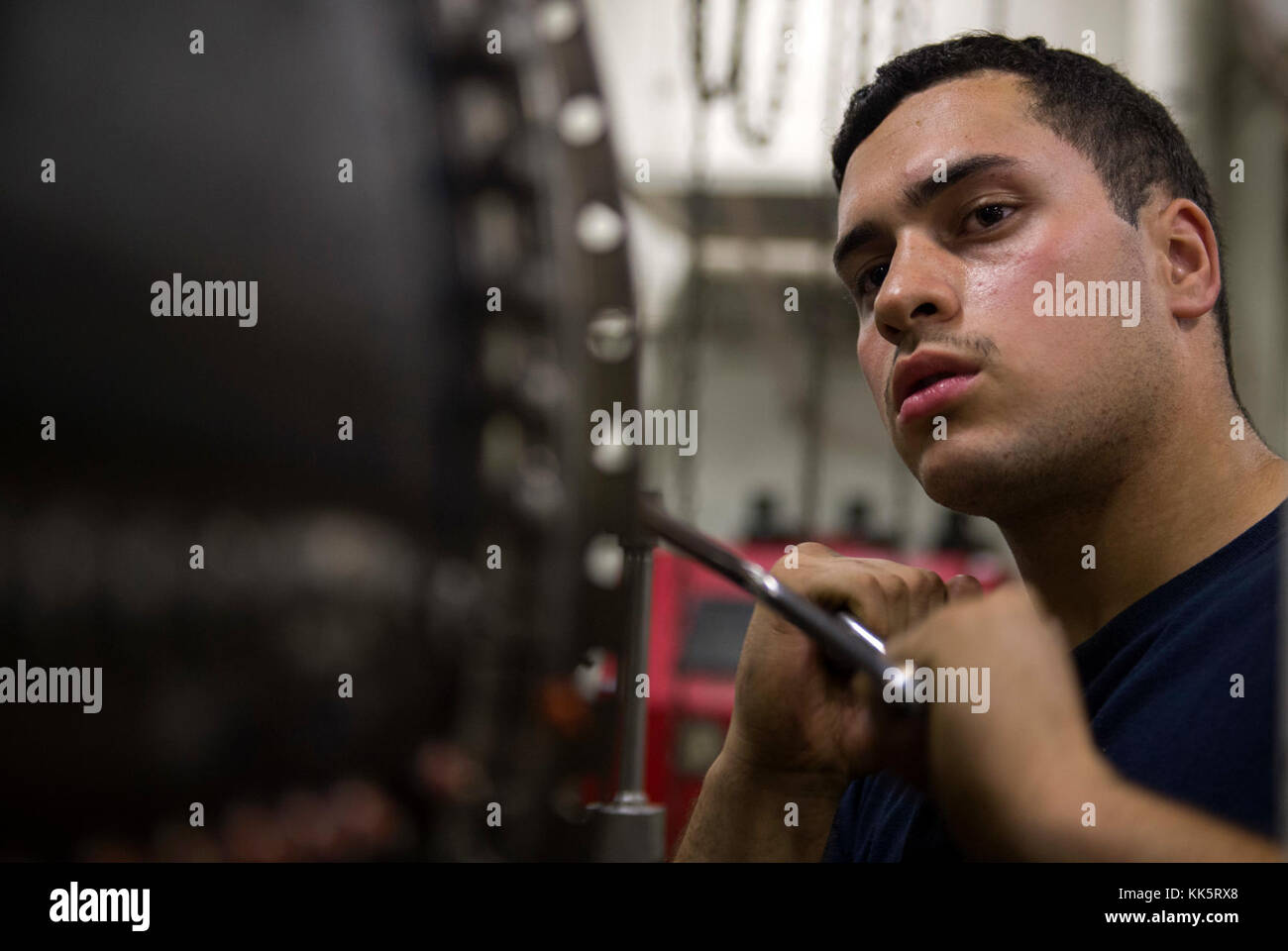 PACIFIC OCEAN (Nov. 13, 2017) Airman Benjamin Morales tightens a bolt ...
