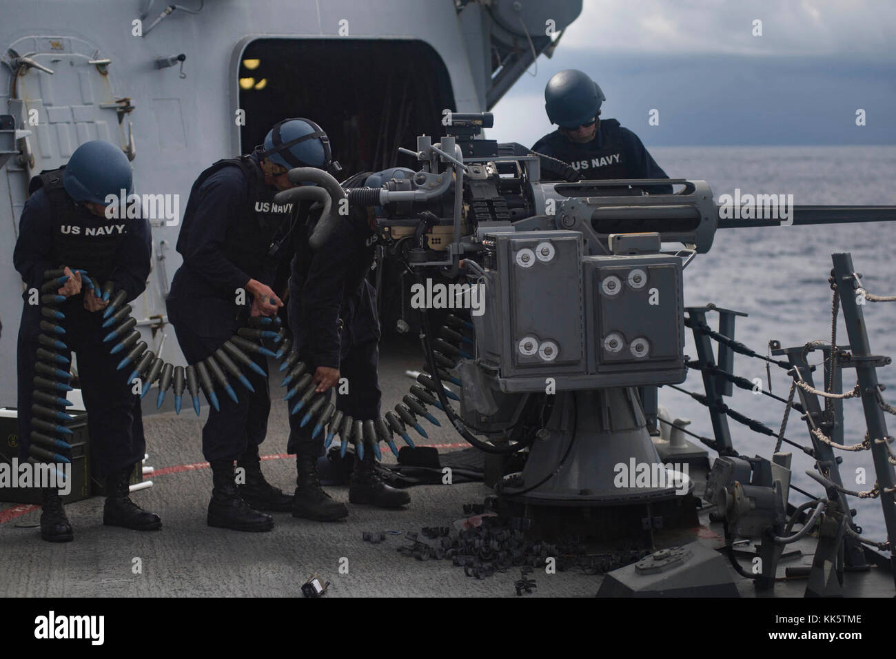 INDIAN OCEAN (Nov. 22, 2017) Sailors load ammunition into a MK 38 MOD 1 ...