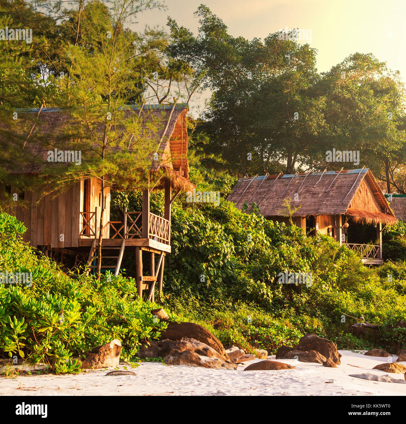 Bamboo huts on tropical island Stock Photo - Alamy