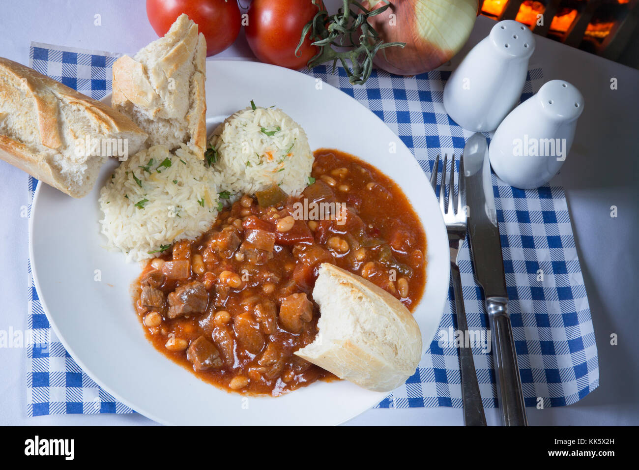 A plate of traditional Turkish White Bean Stew, Etli kuru fasulye, with ...