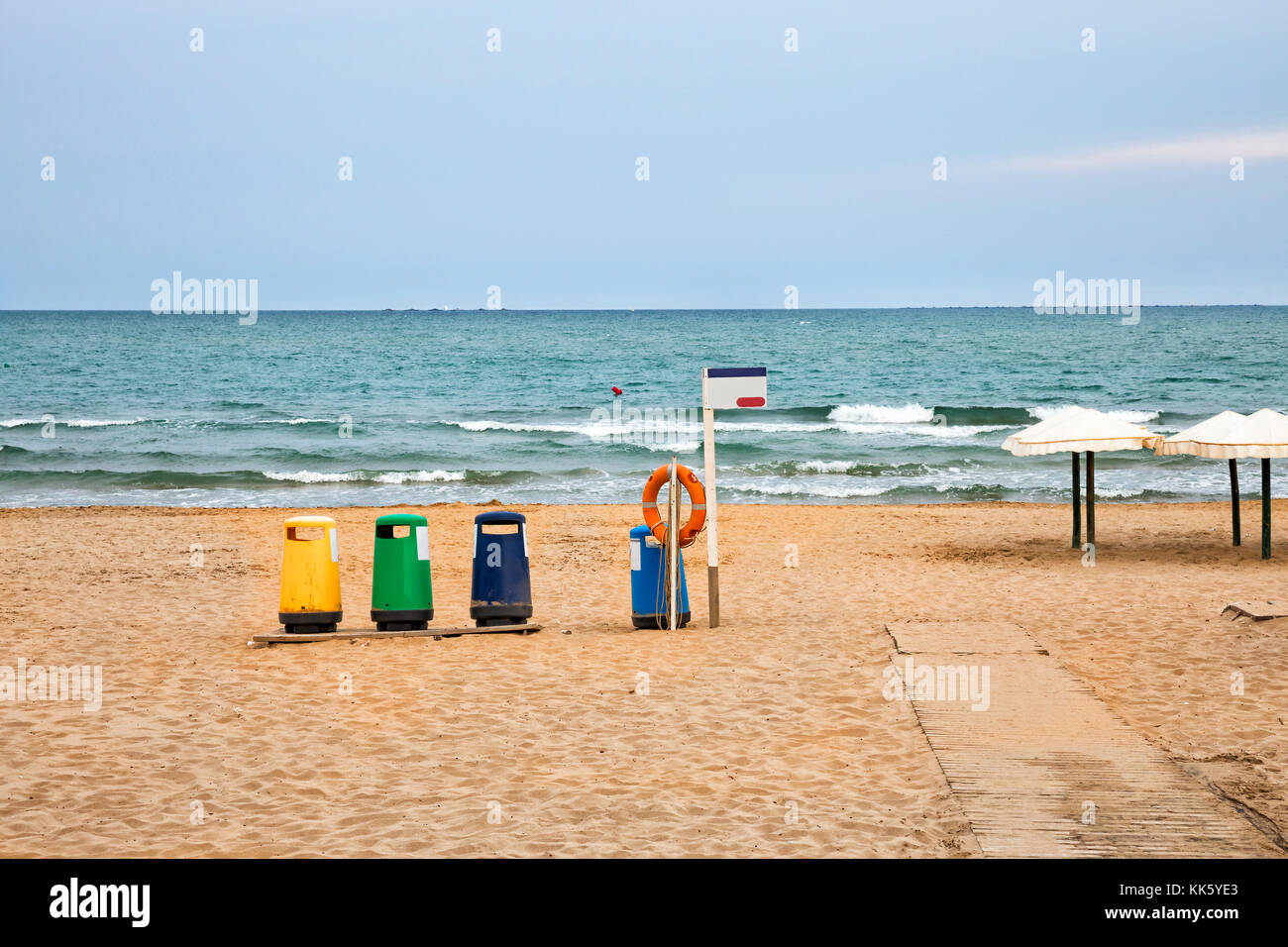 colorful recycle bins in the beach to recycle garbage Stock Photo - Alamy
