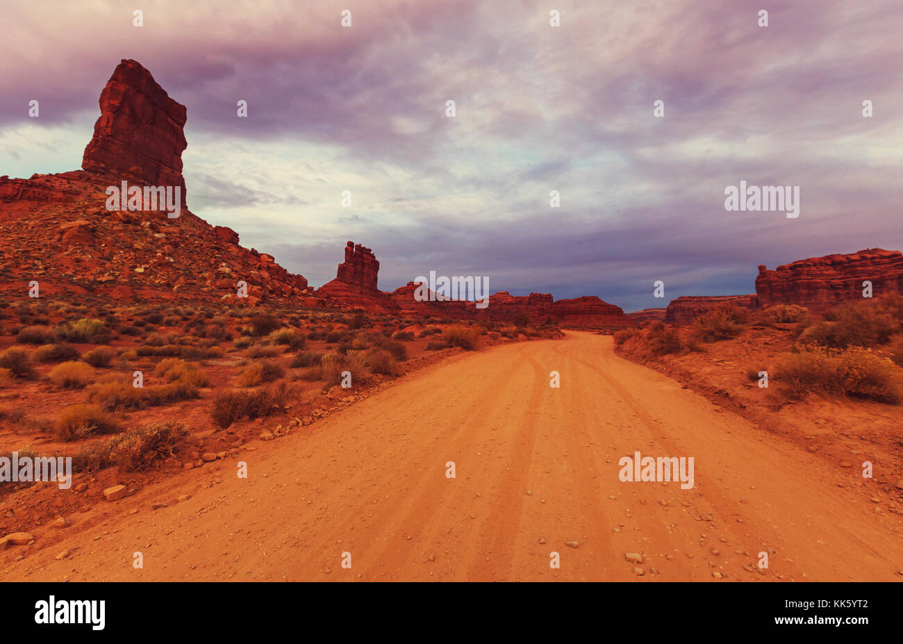 Valley of the Gods rock formation with Monument Valley at sunrise Stock ...