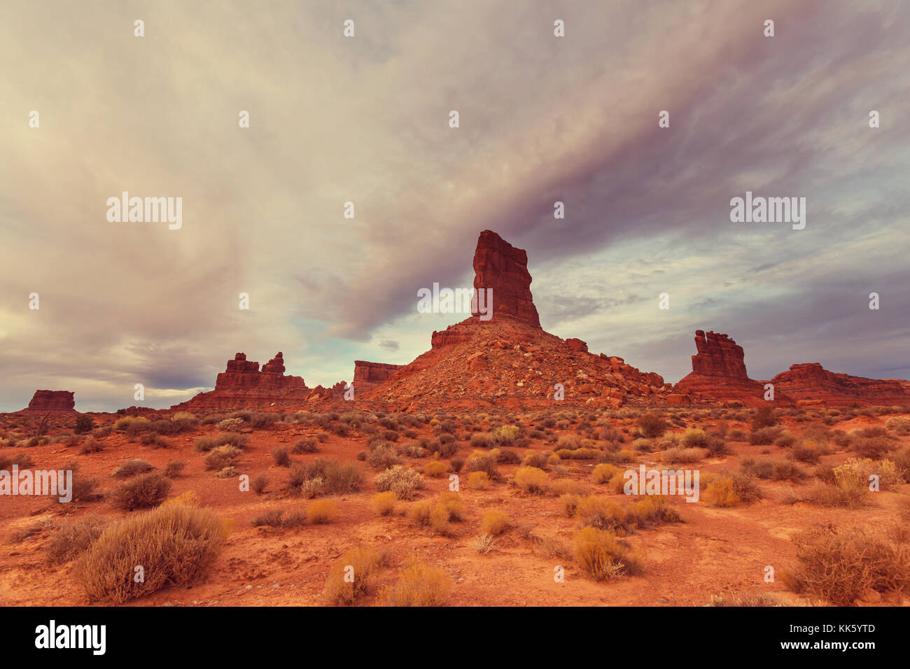 Valley of the Gods rock formation with Monument Valley at sunrise Stock ...