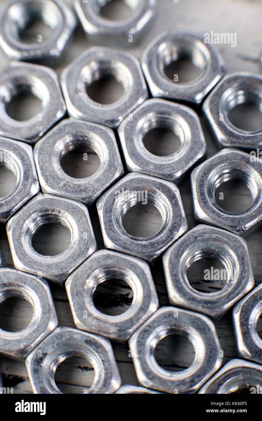 Metal nuts background. Macro. Working tools Fixing elements Stock Photo ...