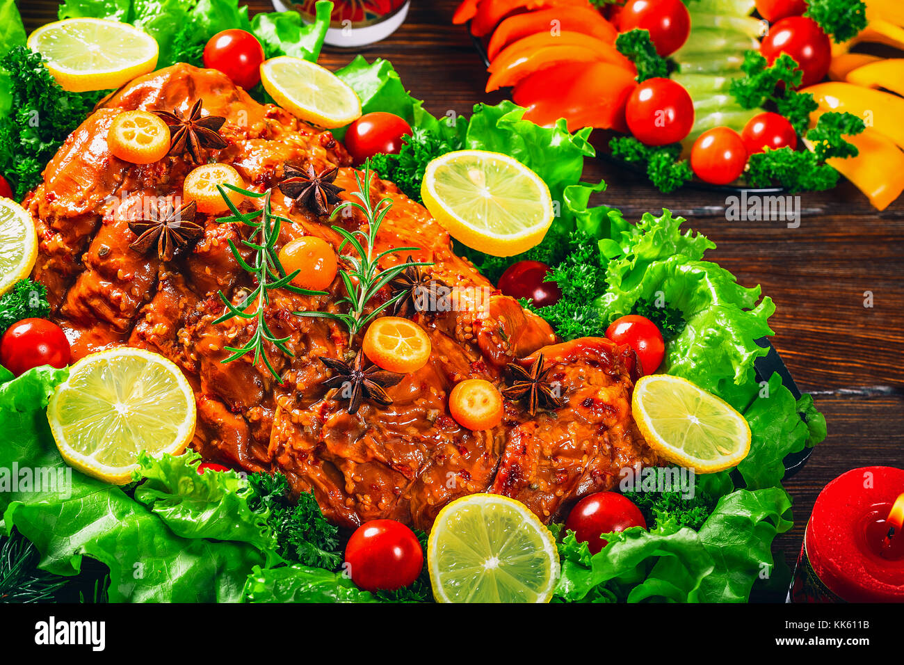 Christmas table dinner time with roasted meats, candles and New Year ...