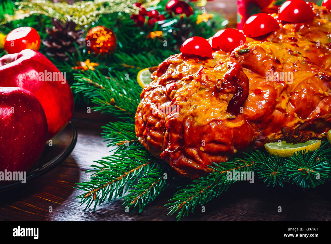 Christmas table dinner time with roasted meats, candles and New Year ...
